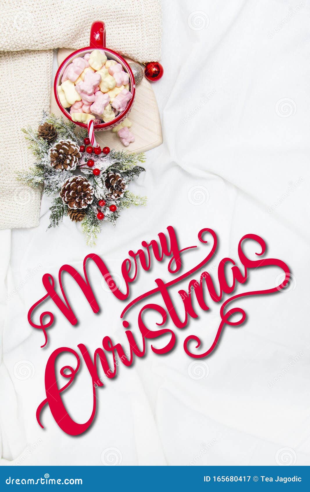 Red Mug with Marshmallows and Winter Ornaments on a White Sheets with ...