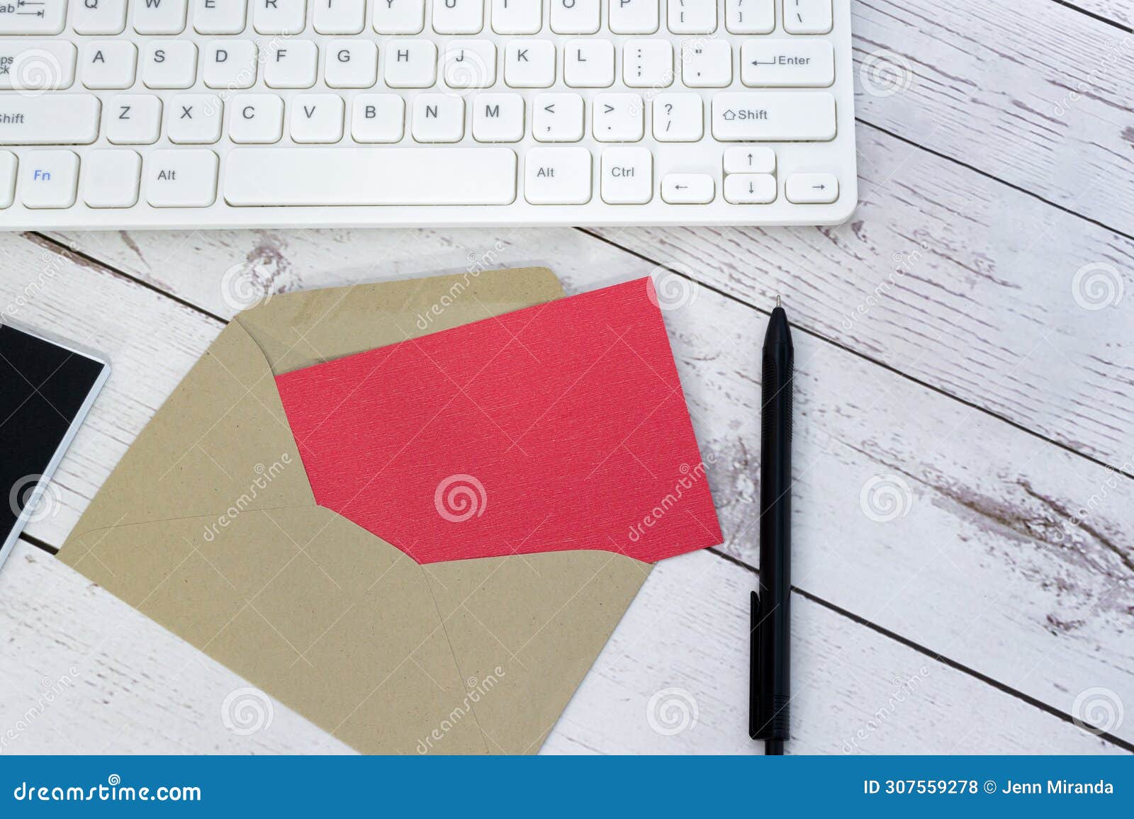 Red Note Inside Brown Envelope with Keyboard on Wooden Desk. Copy Space ...