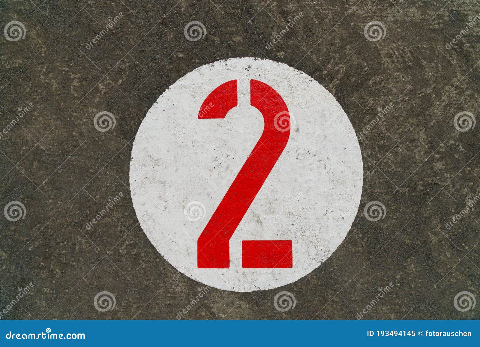 Red Number Two Inside White Circle Painted on Concrete Stock Image ...