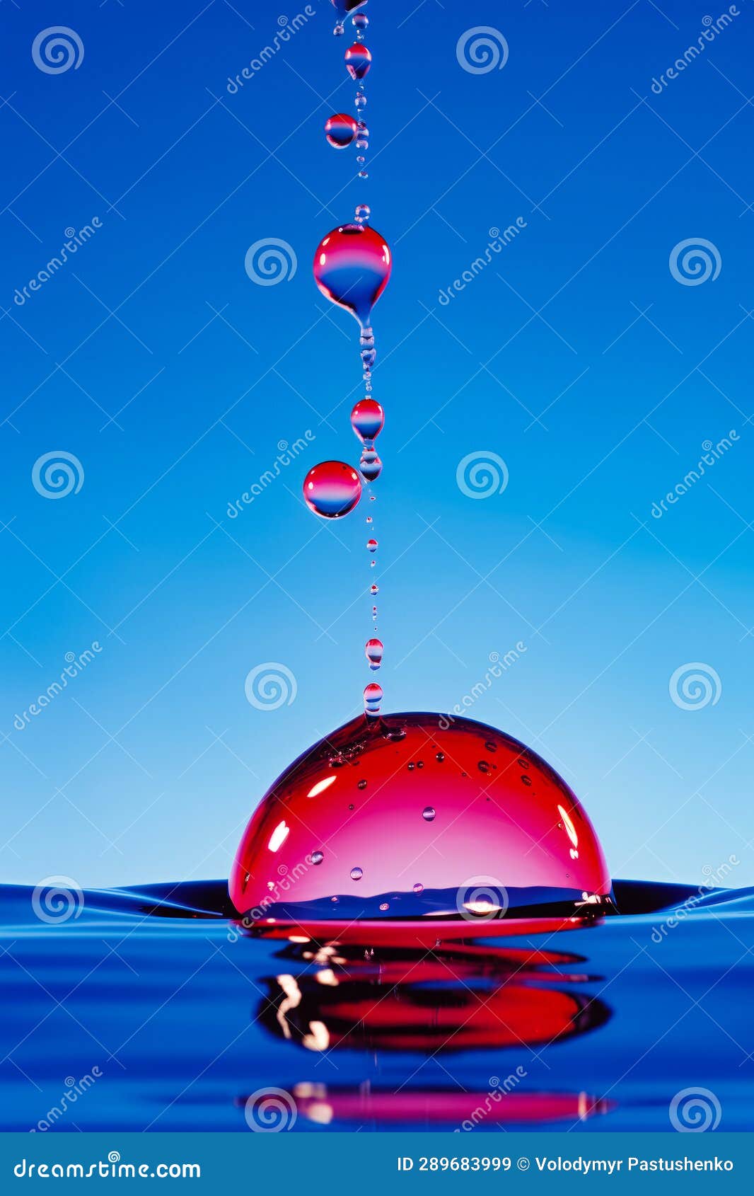 Red Object Floating in Water with Blue Background and Drop of Water ...
