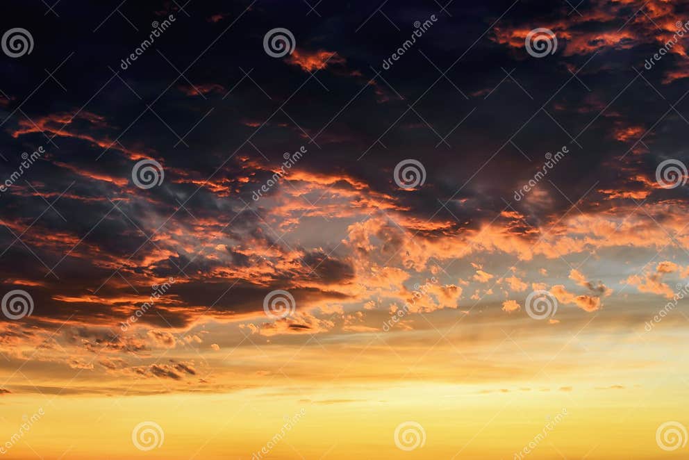 Red Orange Reflections of the Setting Sun on Dark Thunderclouds. Scenic ...