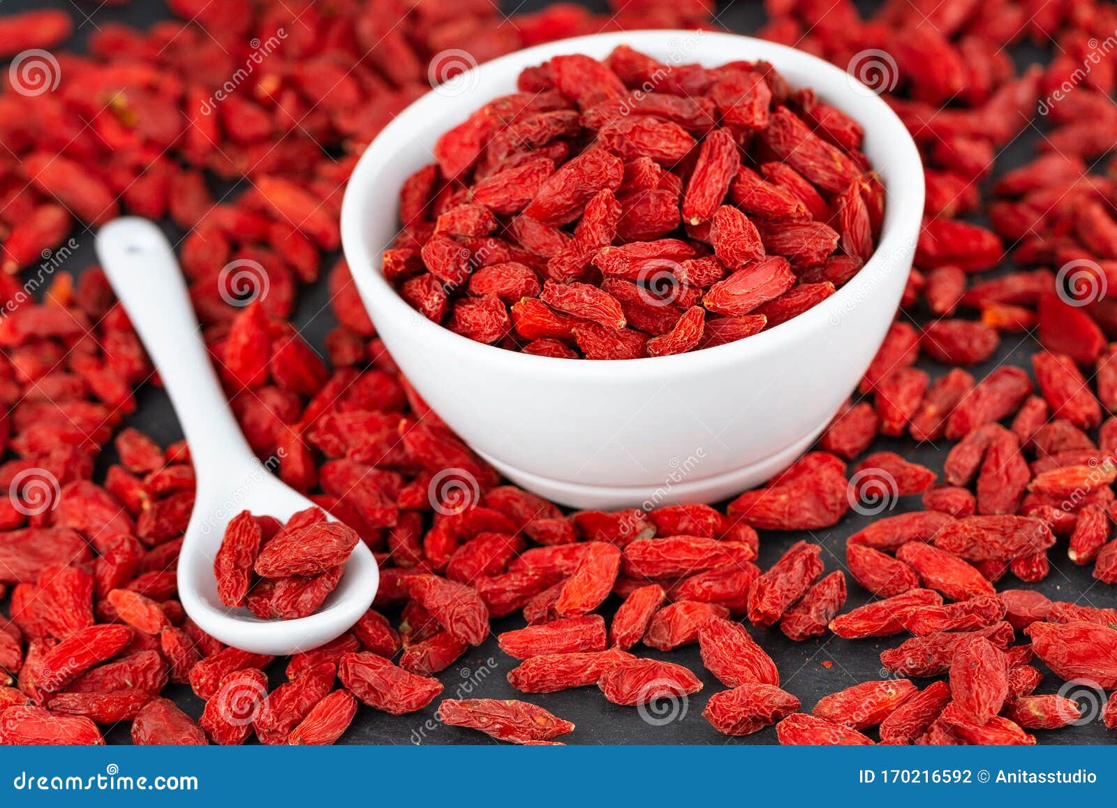 Red Organic Goji Berries in White Cup. Selective Focus Stock Photo ...