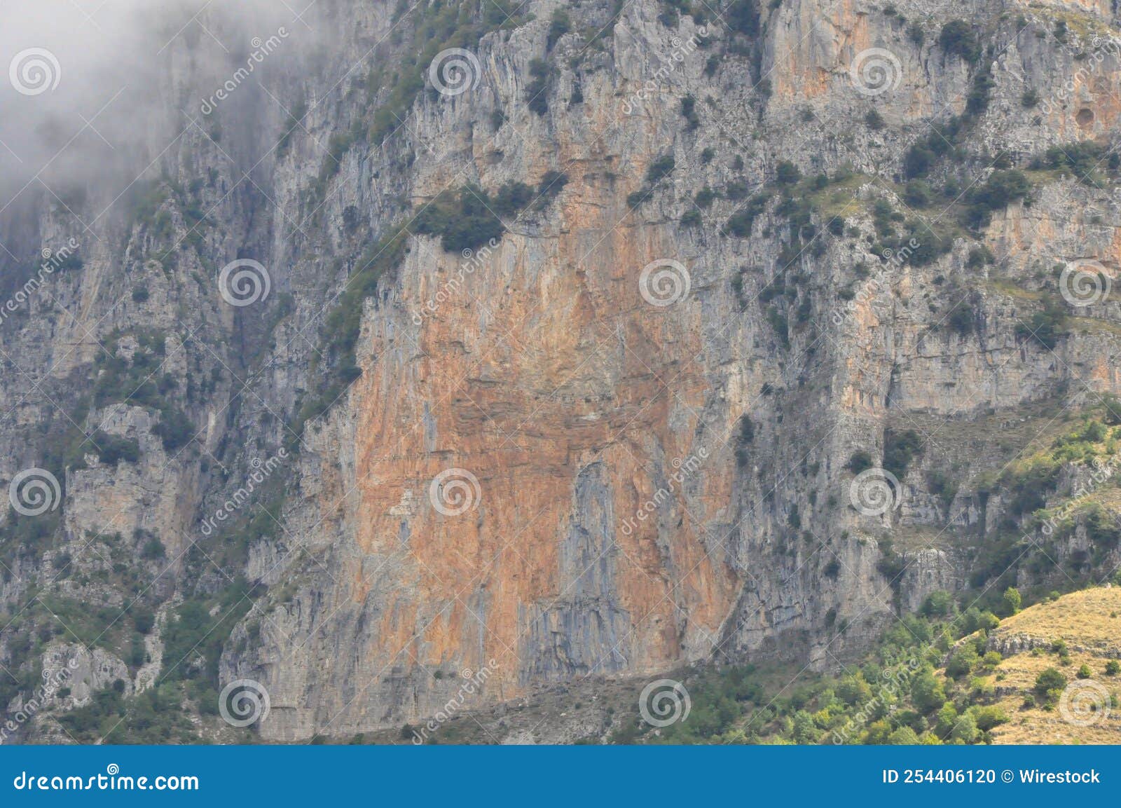 Red rocks on side of cliff stock photo. Image of landscape - 254406120