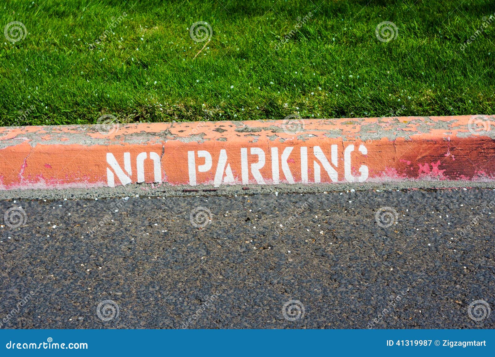 A Curb Sign Points To A Stip Mall Across Road Royalty-Free Stock ...