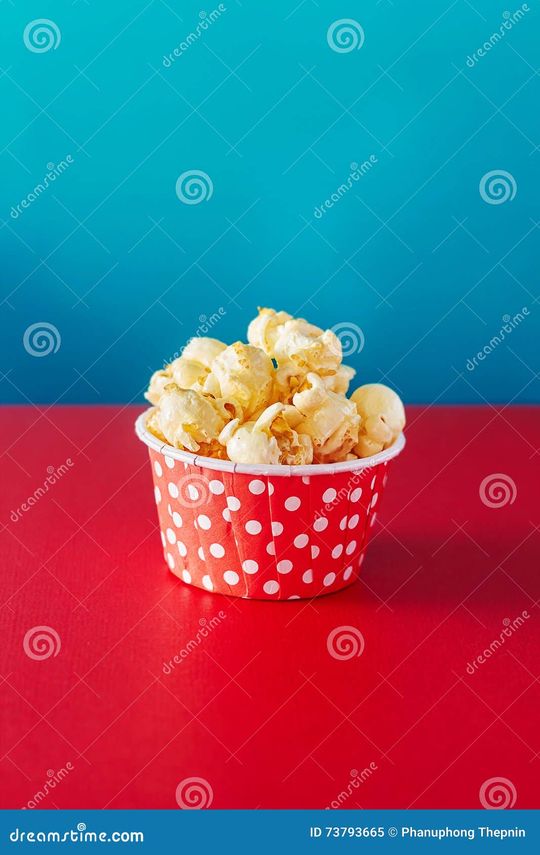 Red Paper Cup with Popcorn Against Vibrant Background. Stock Image ...