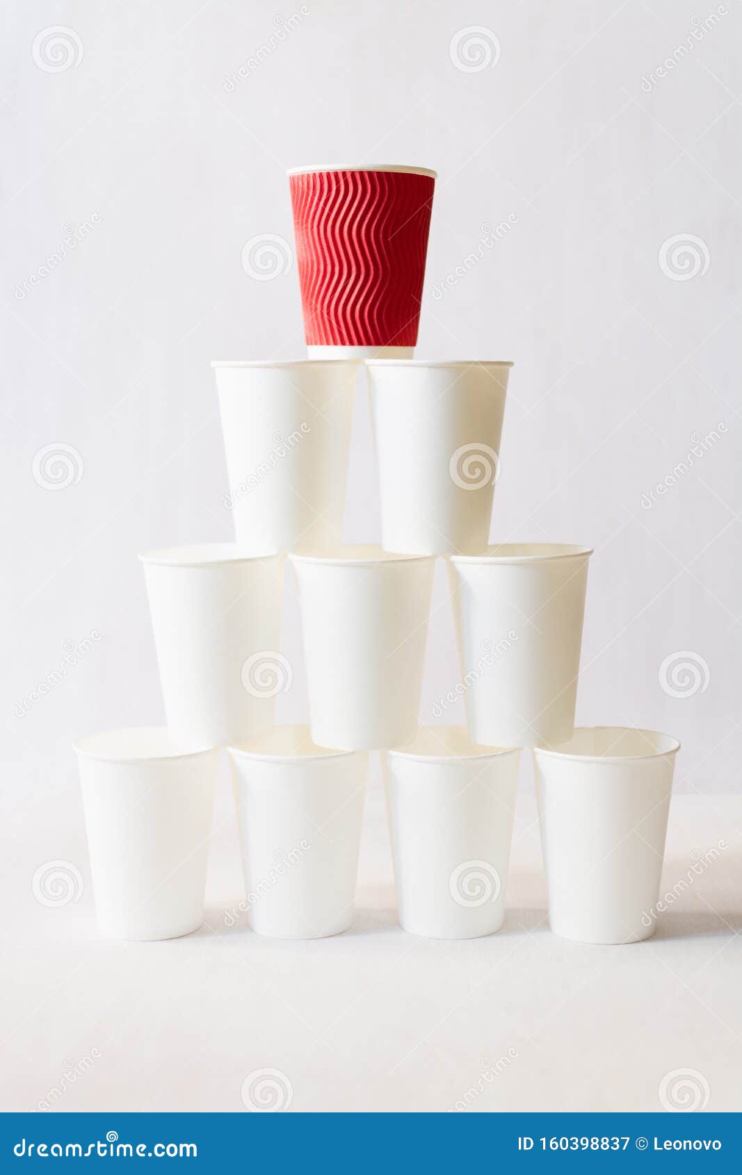 Red Paper Cup Stands on Top of White Paper Cups Pyramid Stock Image ...