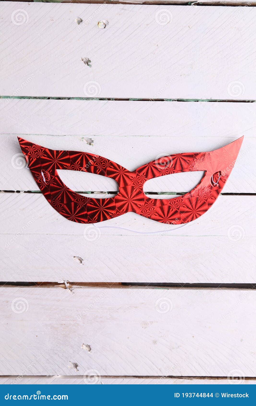 Red Paper Masquerade Mask on a White Wooden Surface Stock Photo - Image ...
