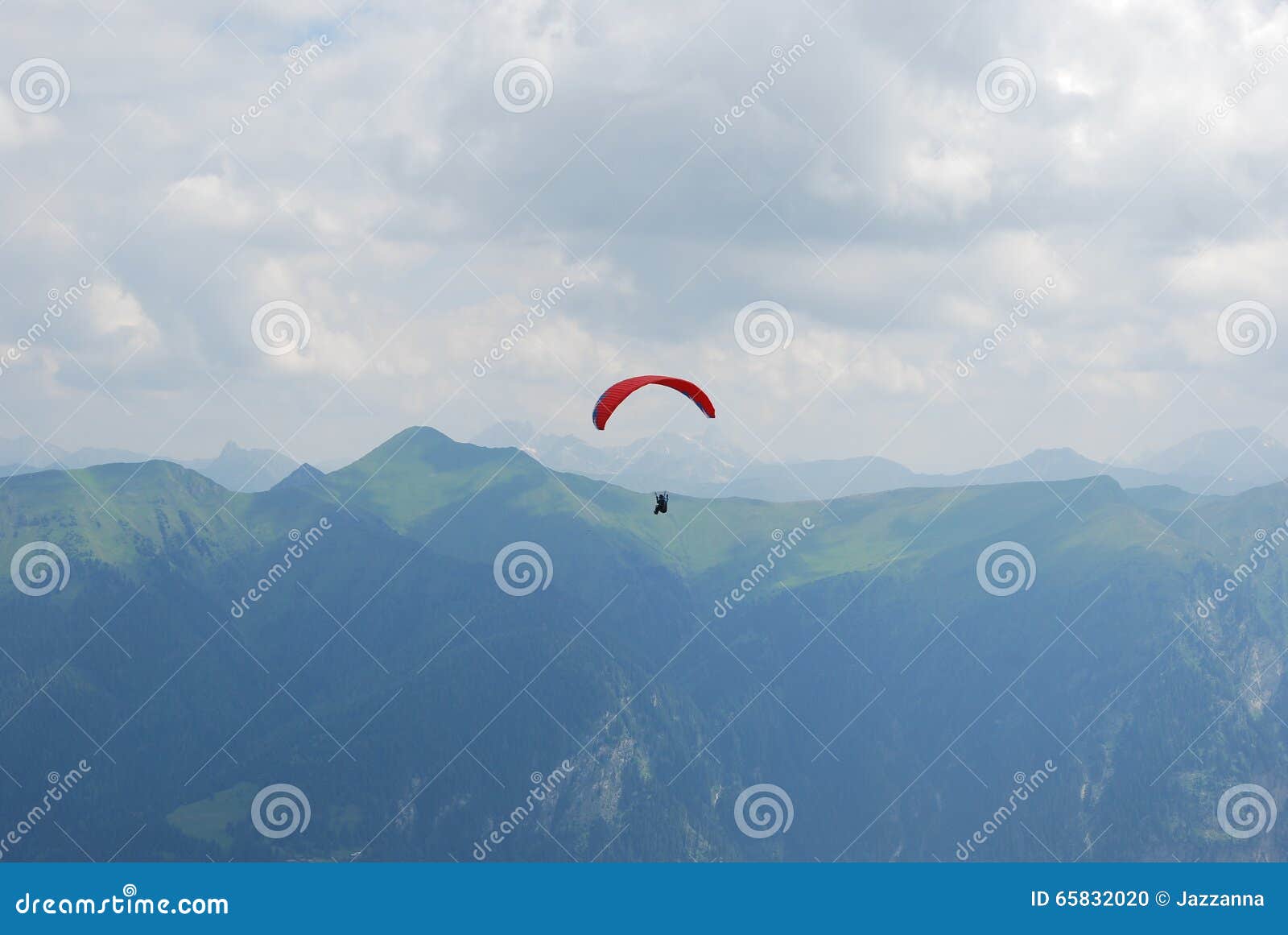 Red parachute in the alps stock photo. Image of floating - 65832020