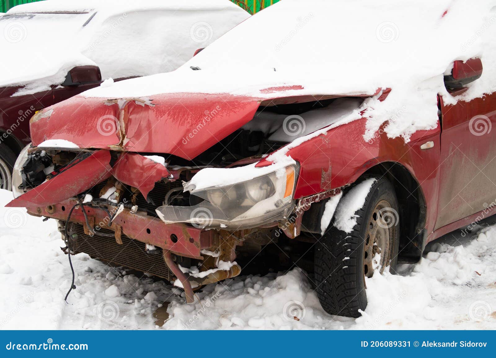 Red Passenger Car with a Broken Front End Covered with Snow Stock Image ...