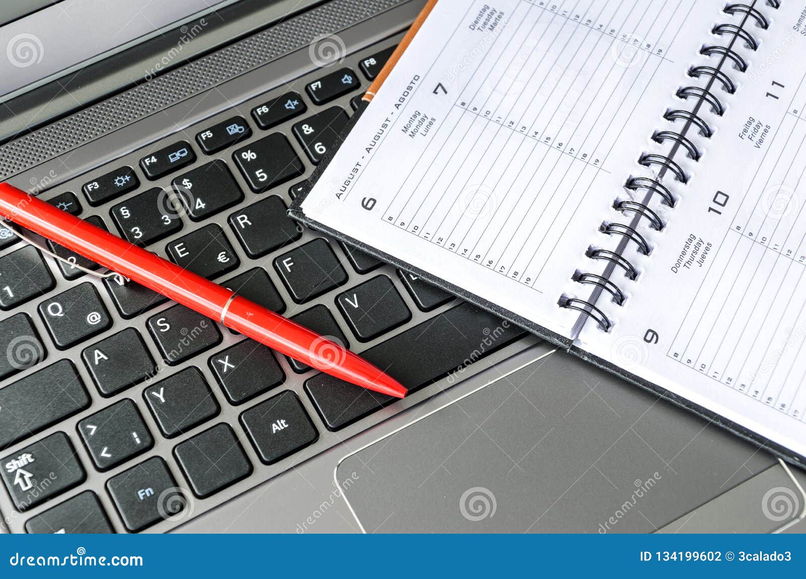 Red Pen and Schedule Lying on Computer Keypad Stock Photo - Image of ...