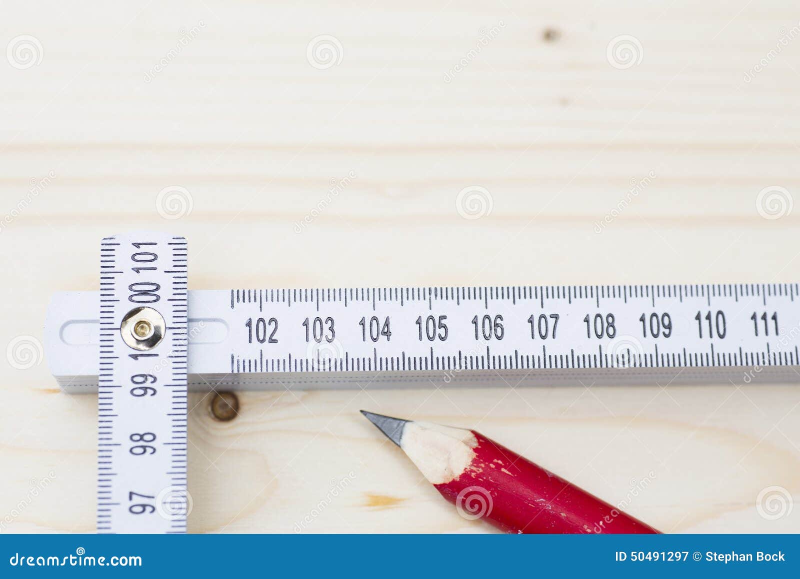 Red Pencil and Folding Ruler Lying on Wooden Board Stock Image - Image ...