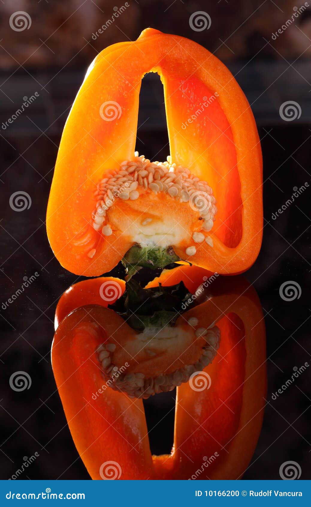 Red pepper half on black stock photo. Image of freshly - 10166200