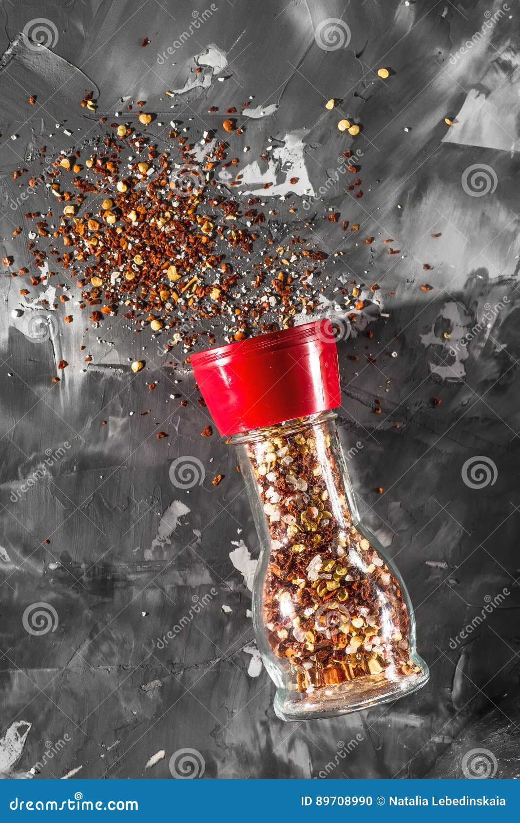 Red Pepper Mill with Spices and Salt on Gray Stock Photo - Image of ...