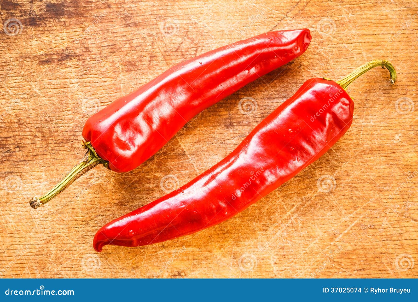 Red Peppers on Old Wooden Table Stock Photo - Image of closeup, garnish ...