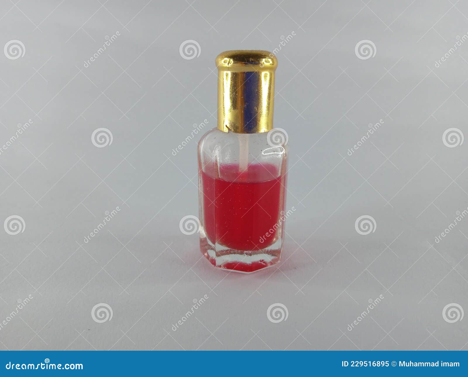 Red Perfume with Gold Cap on White Background Stock Image - Image of ...