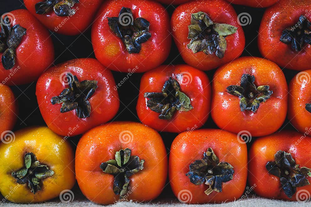 Red Persimmons stock photo. Image of cuttingboard, nature - 83291638