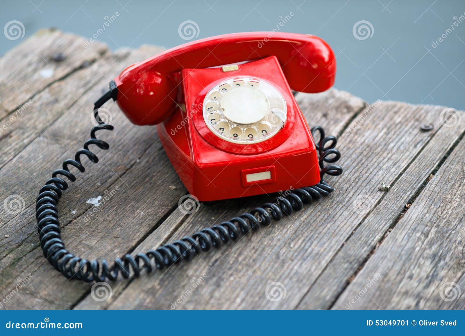 Red phone on wooden deck stock image. Image of shiny - 53049701