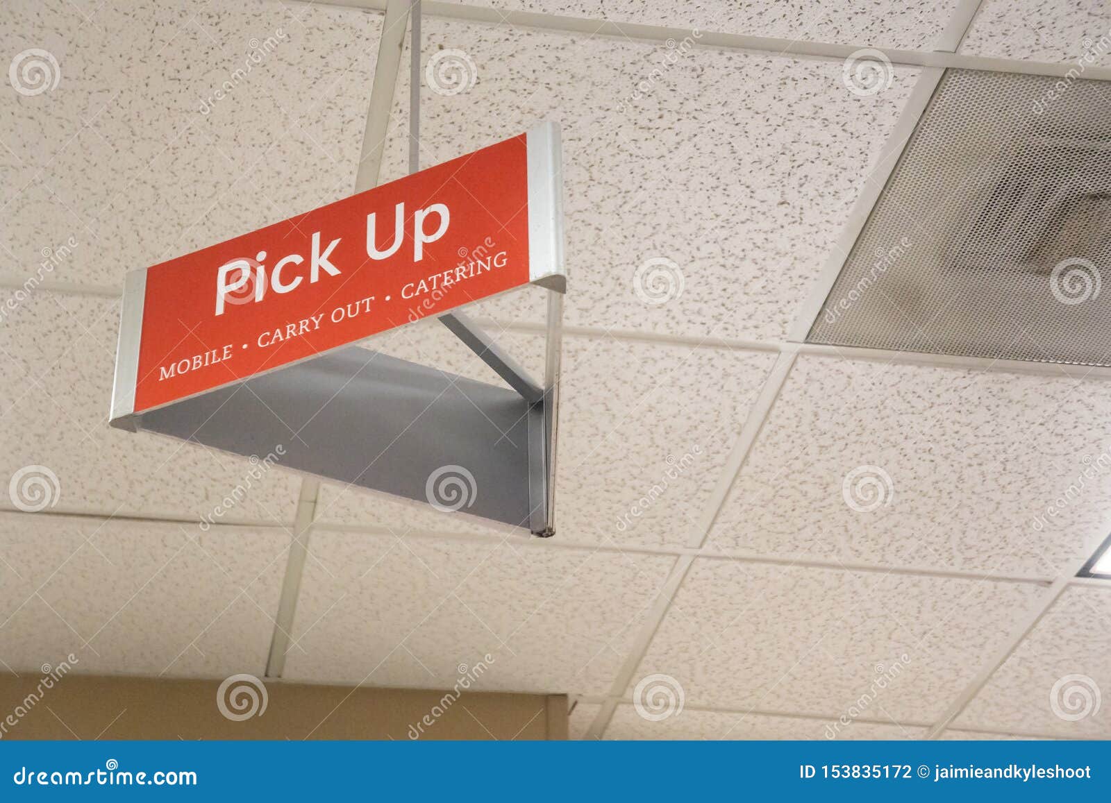 Red Pick Up Carry Out Sign On Tile Ceiling For Mobile App Orders At