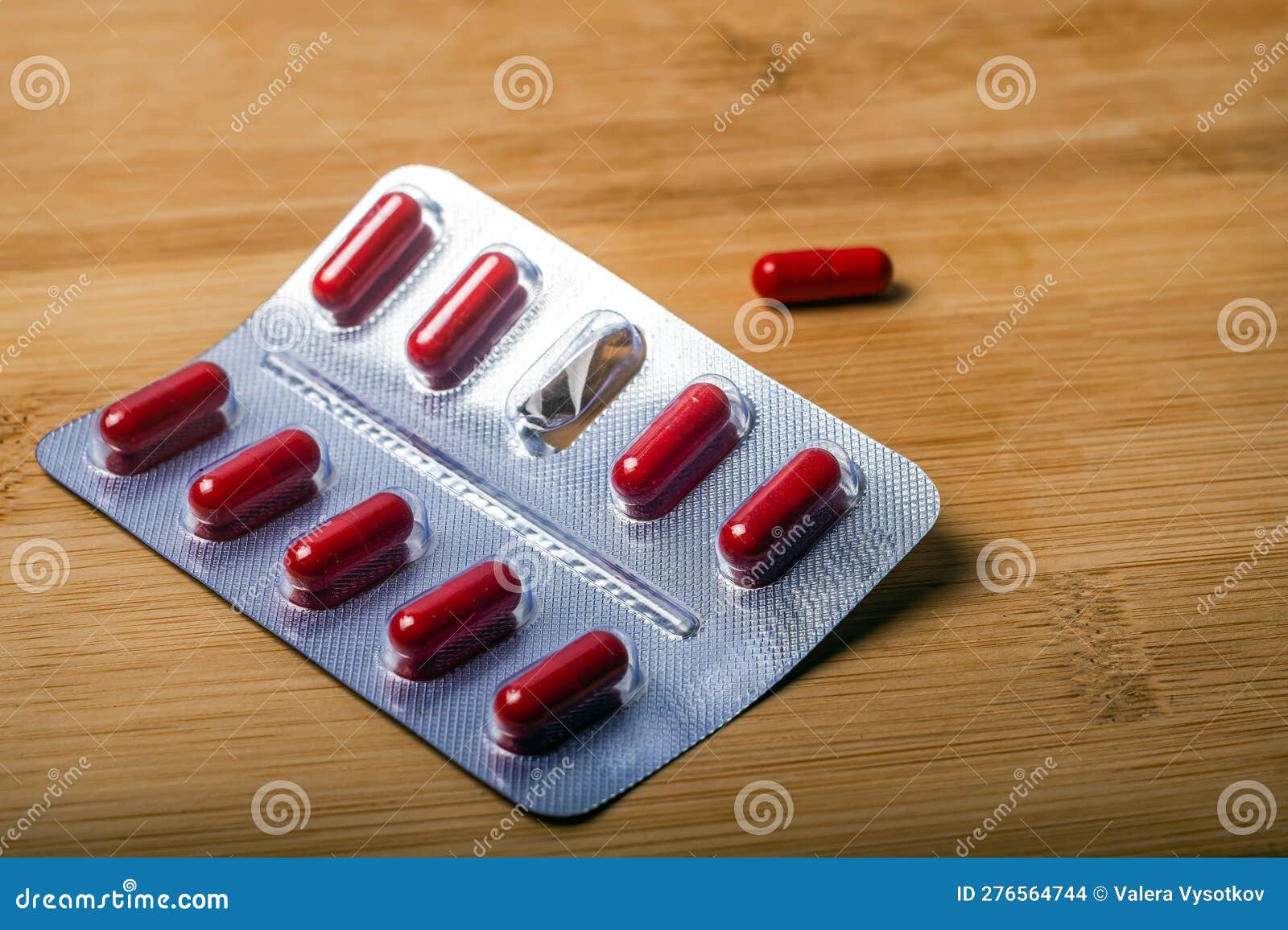 Red pills on the table stock photo. Image of medicine - 276564744