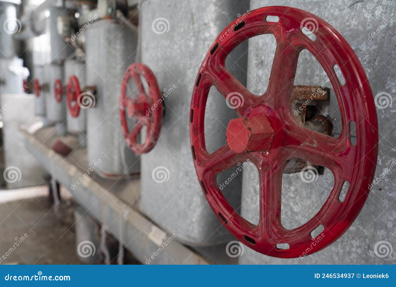 Red Pipes and Valve Handle Wheel at the Abandonned Ruin Stock Image ...