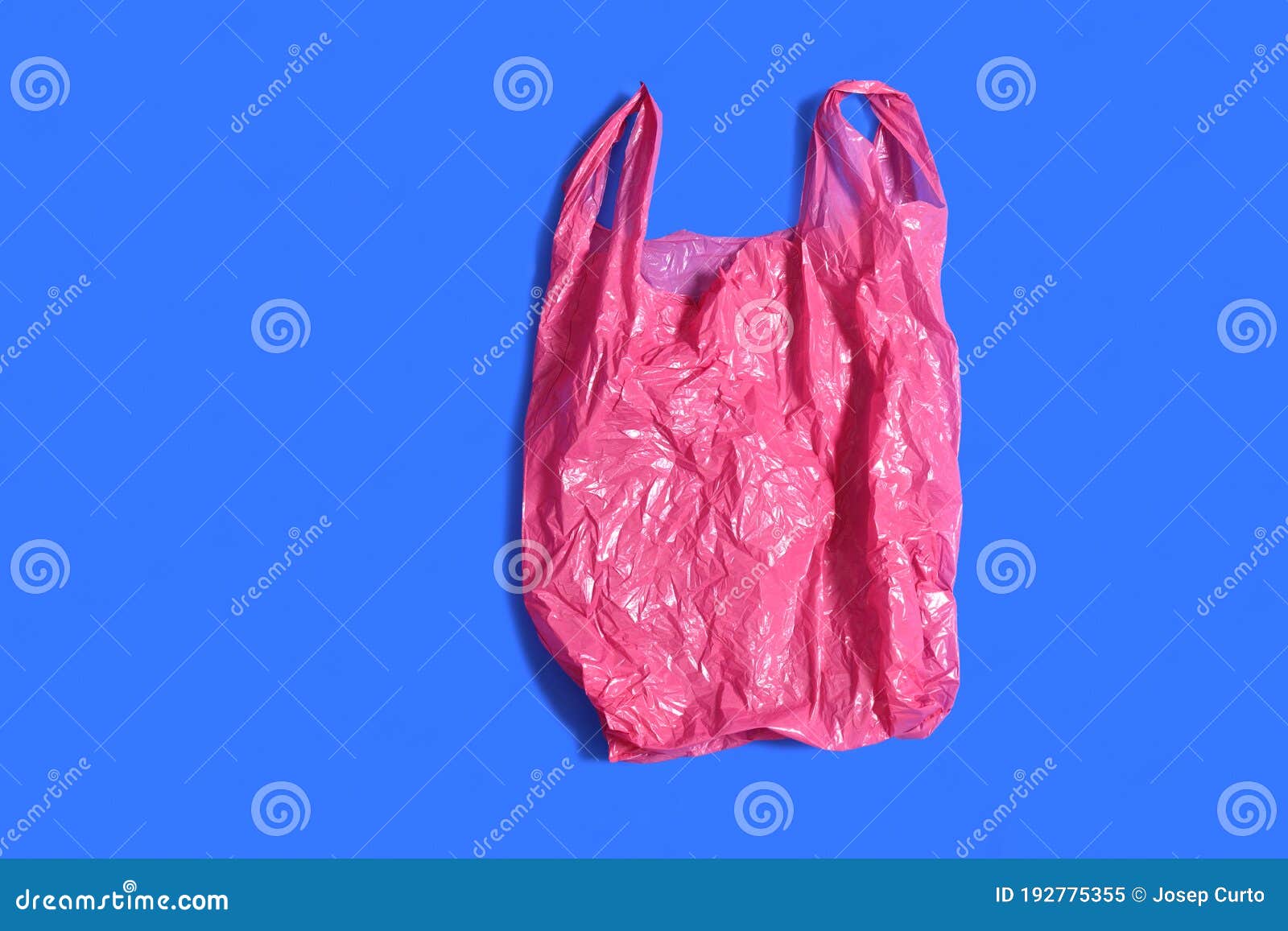 Red plastic bag on blue stock image. Image of recycle - 192775355