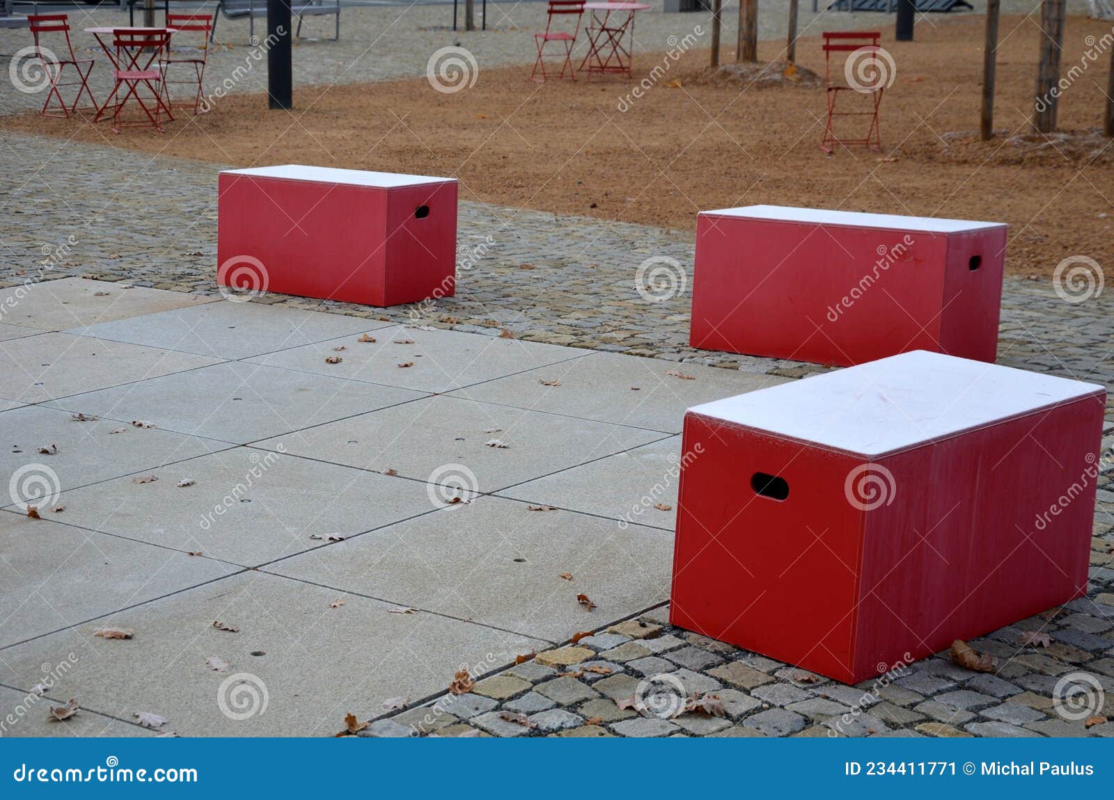 Red Plastic Benches in the Shape of Blocks with Handles. the Square is ...