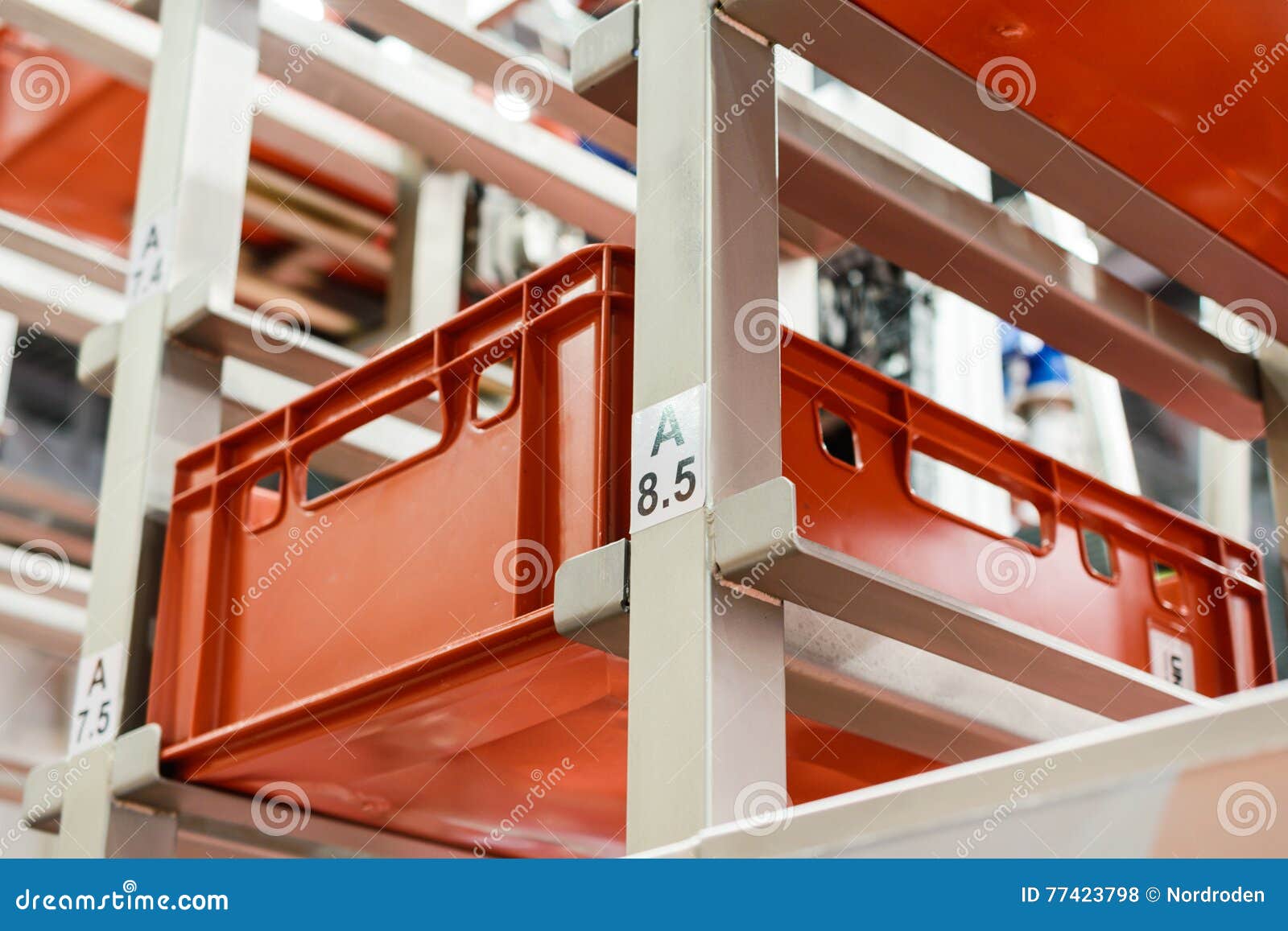 Red Plastic Boxes in the Cells of the Automated Warehouse. Stock Photo ...