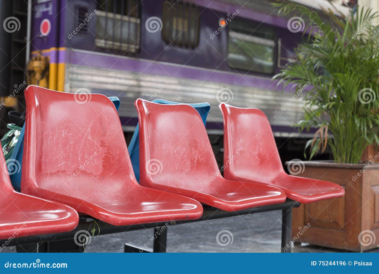 Red Plastic Chair at Train Station Stock Photo - Image of airport ...