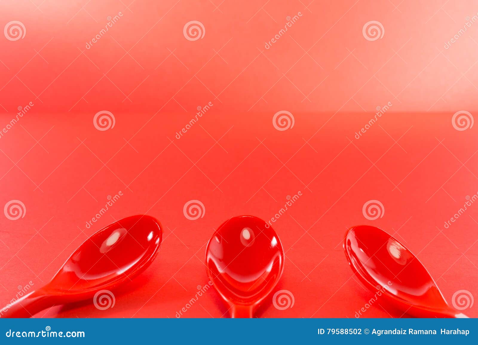 Red Plastic Spoons on Red Background Stock Photo - Image of studio ...