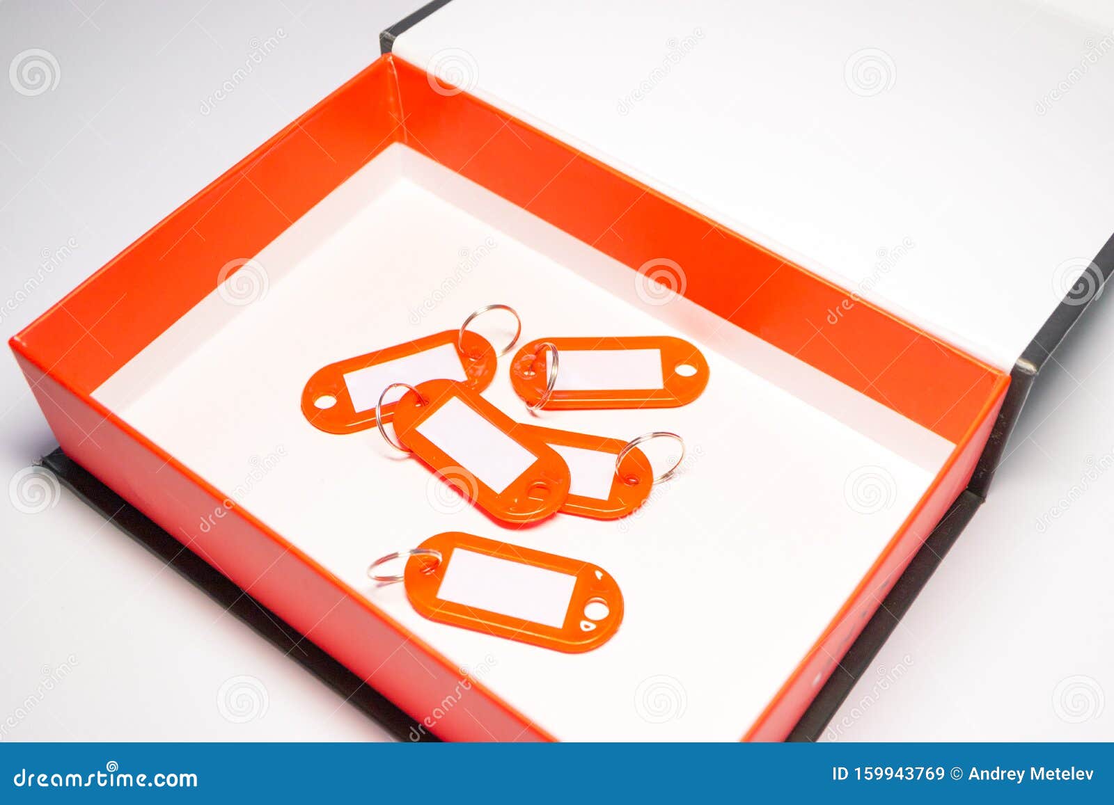 Red Plastic Tags for Numbering Keys in a Red Box Stock Image - Image of ...