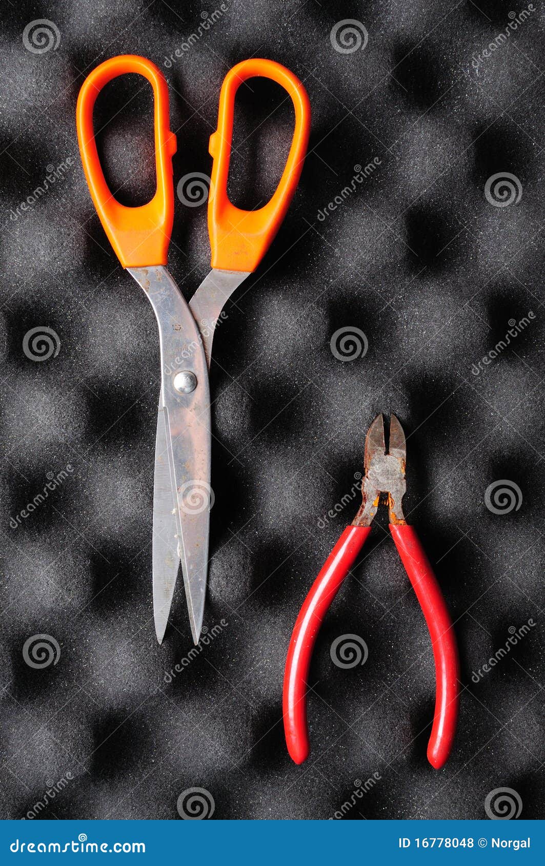 Red Pliers and Orange Scissors on Sponge Stock Photo - Image of plier ...