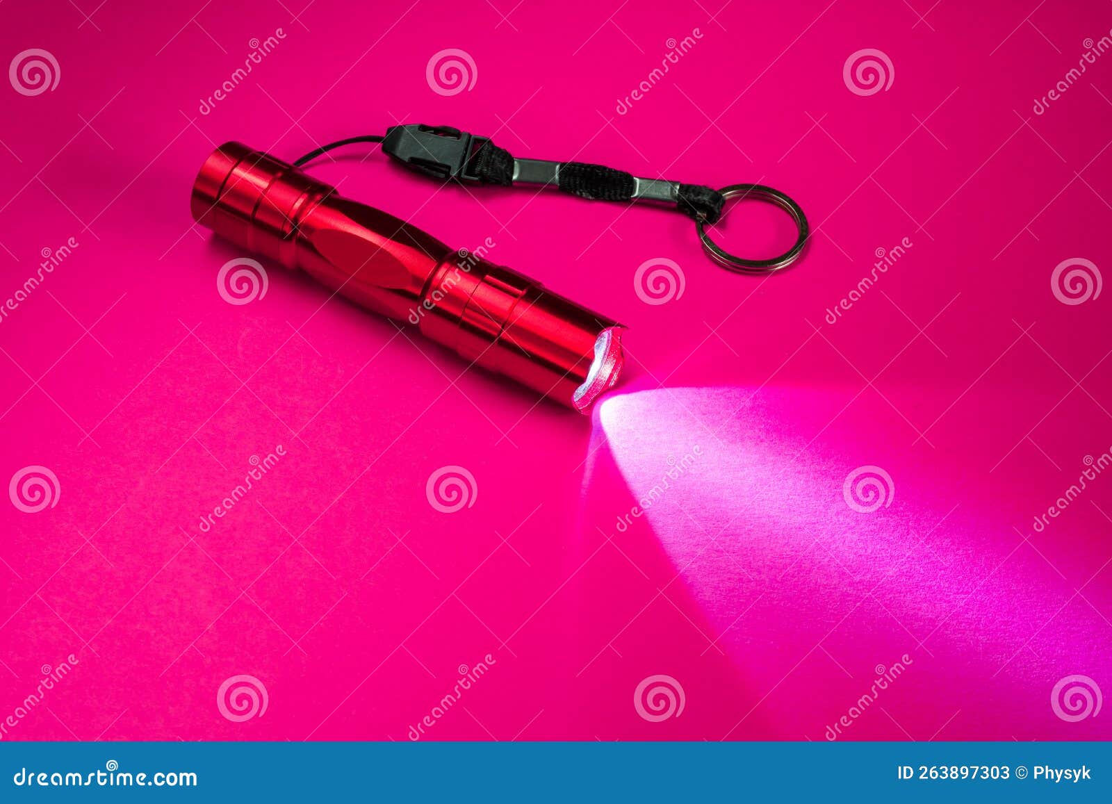 Red Pocket Flashlight on a Red Surface Stock Image - Image of clasp ...