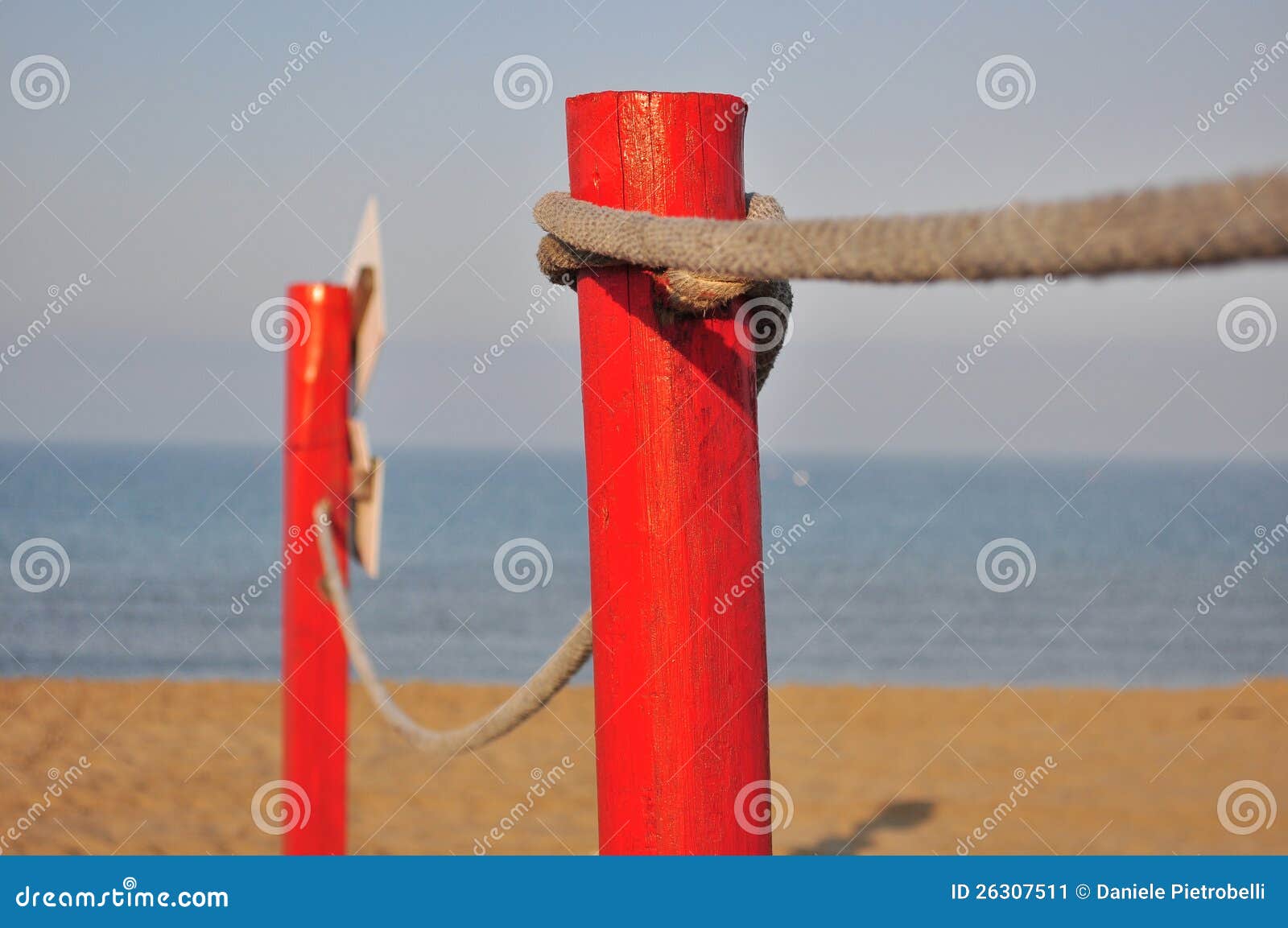 Red pole on the beach stock image. Image of lifeguard - 26307511