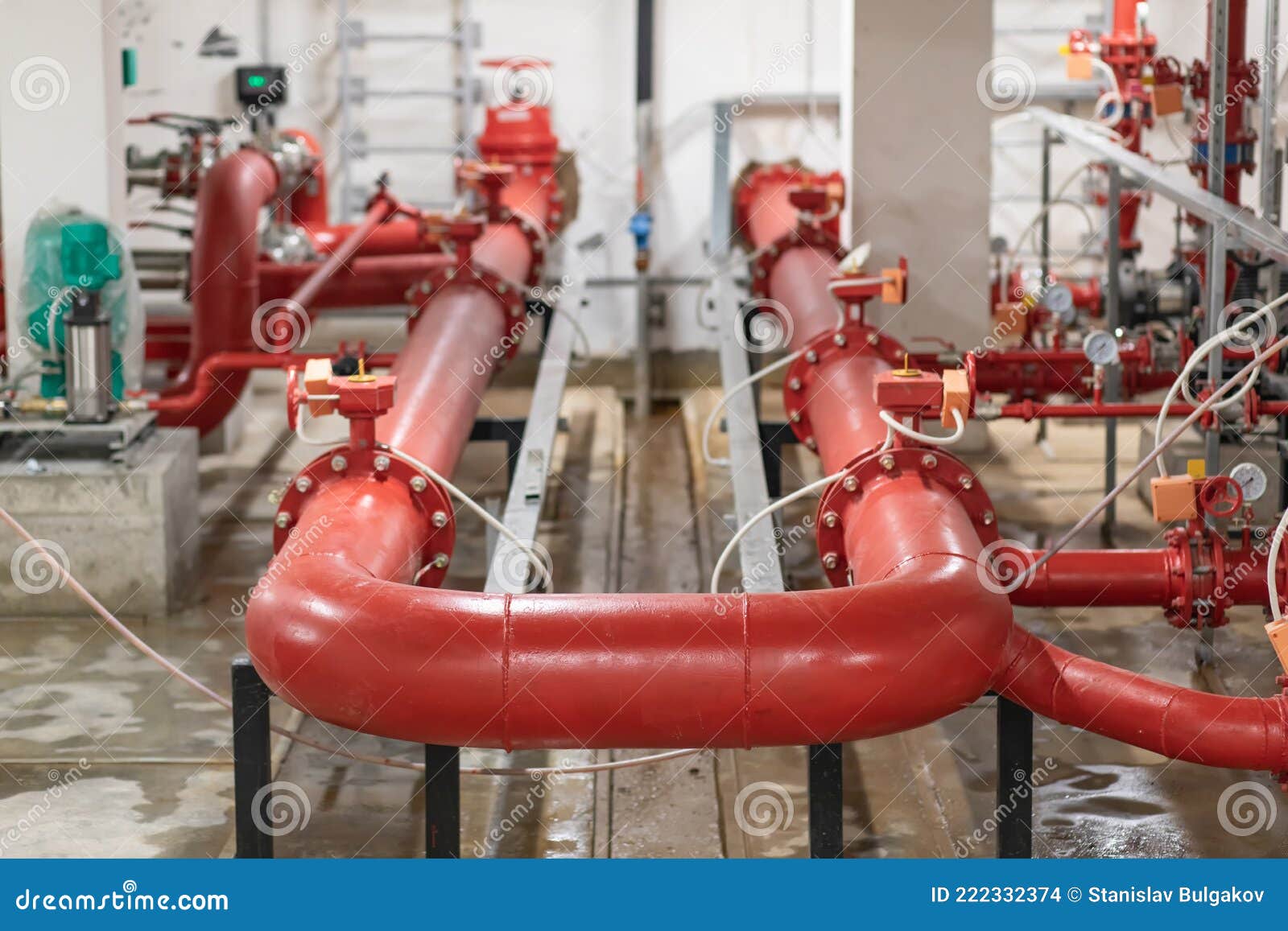 Red Pumps of Water Supply System in Basement of Building. Stock Photo ...