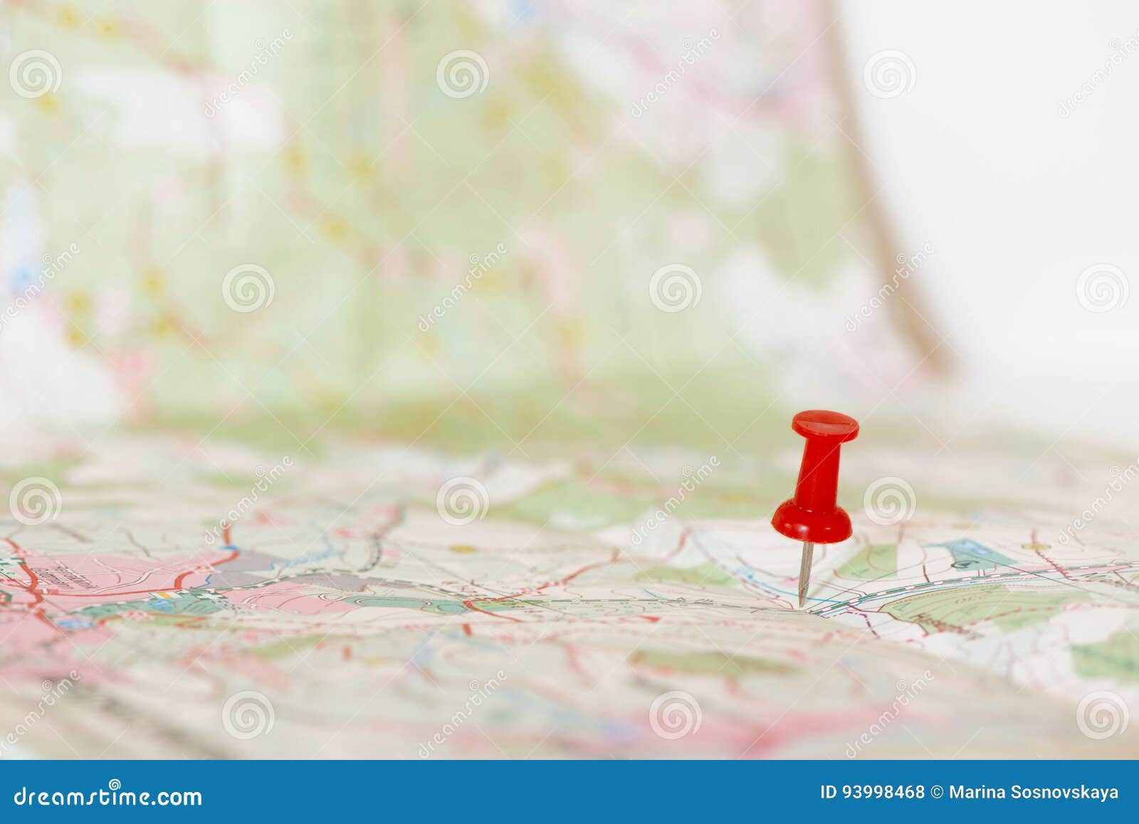 Red Pushpin Marking a Location on an Open Map Stock Photo - Image of ...