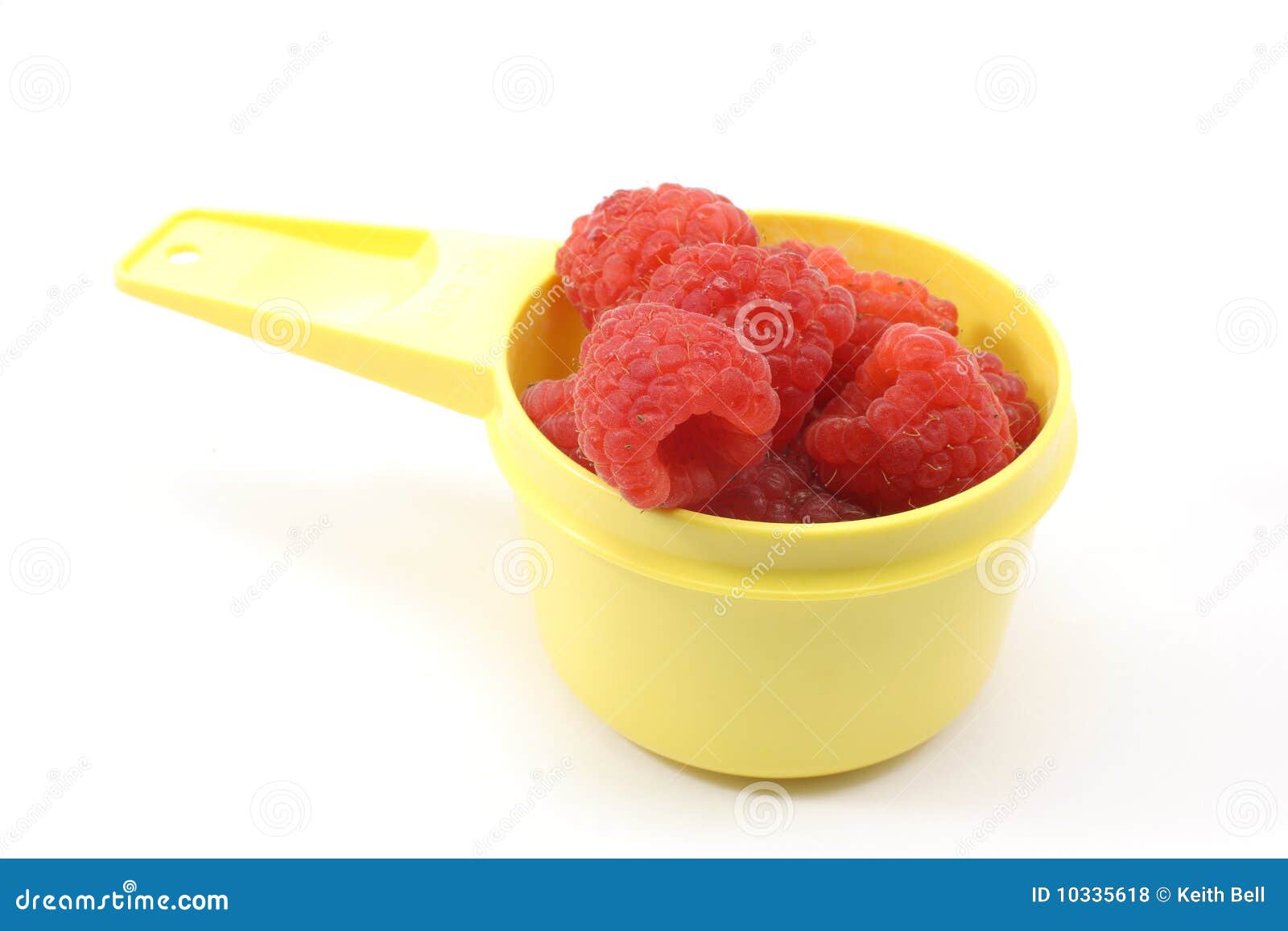 Red Raspberries in Yellow Measuring Cup Stock Photo - Image of ...