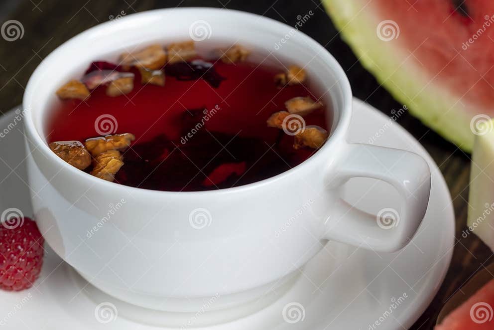 Red Raspberry Tea with Pieces of Fruit and Berries Stock Photo - Image ...
