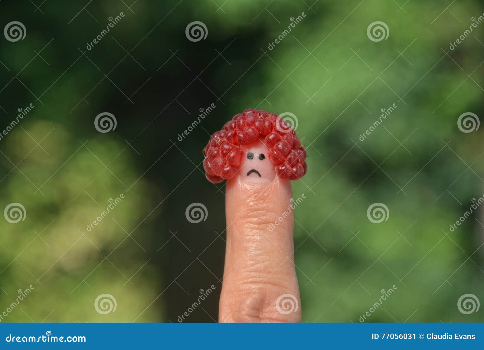Red Raspberry on the Thumb with a Sad Face Stock Image - Image of poor ...