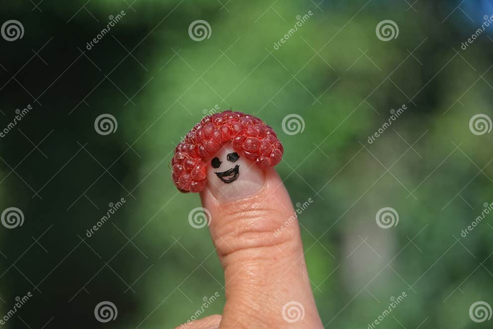 Red Raspberry on the Thumb with a Smiling Face Stock Image - Image of ...