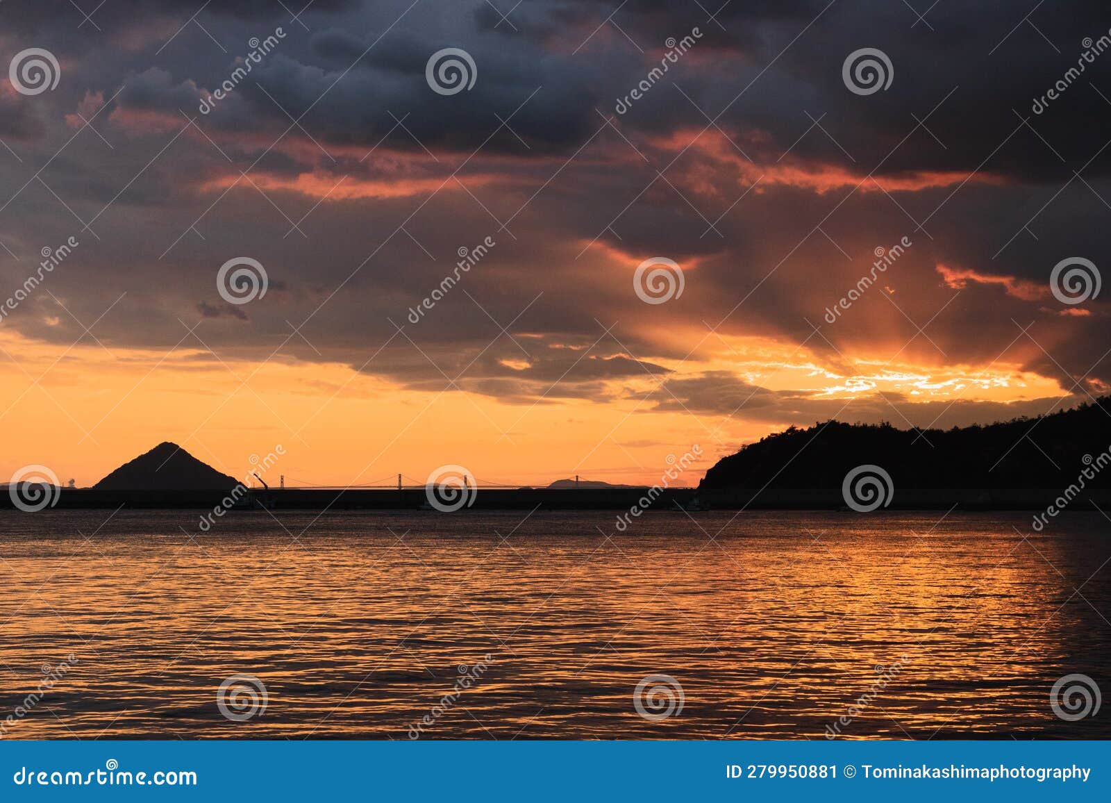 Red Rays of Light Seeping through the Clouds , Naoshima Stock Image ...