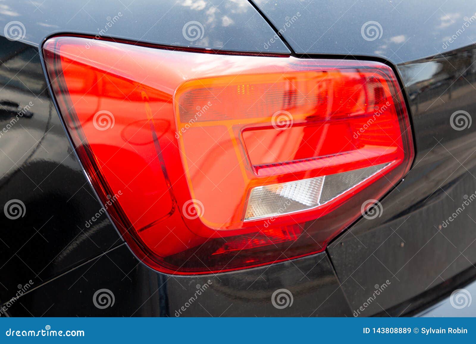 Red Rear Light on a Modern Car with Reflection Stock Image - Image of ...