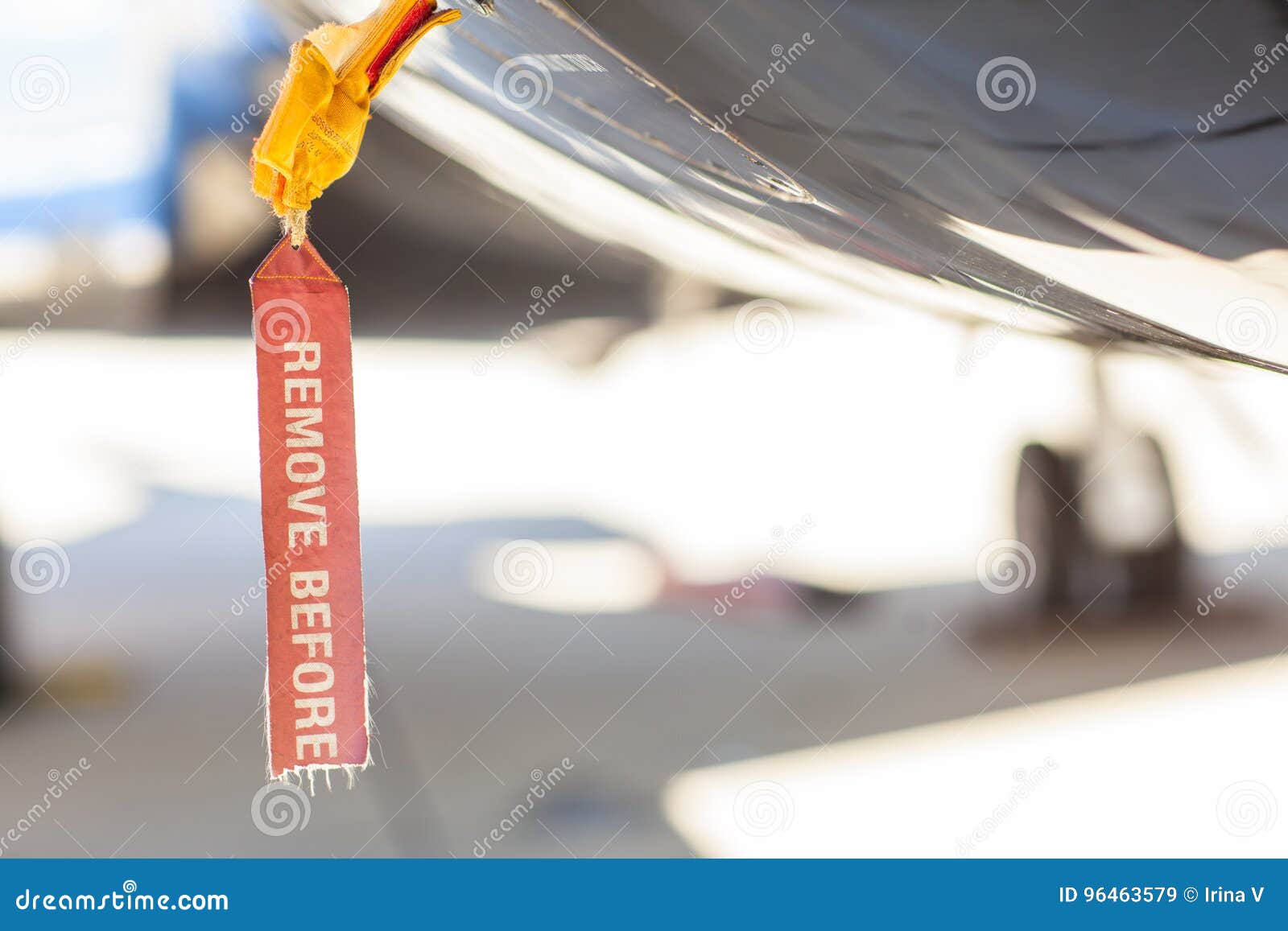 Red Remove before Flight Tag on an Airplane Fuselage Stock Image ...