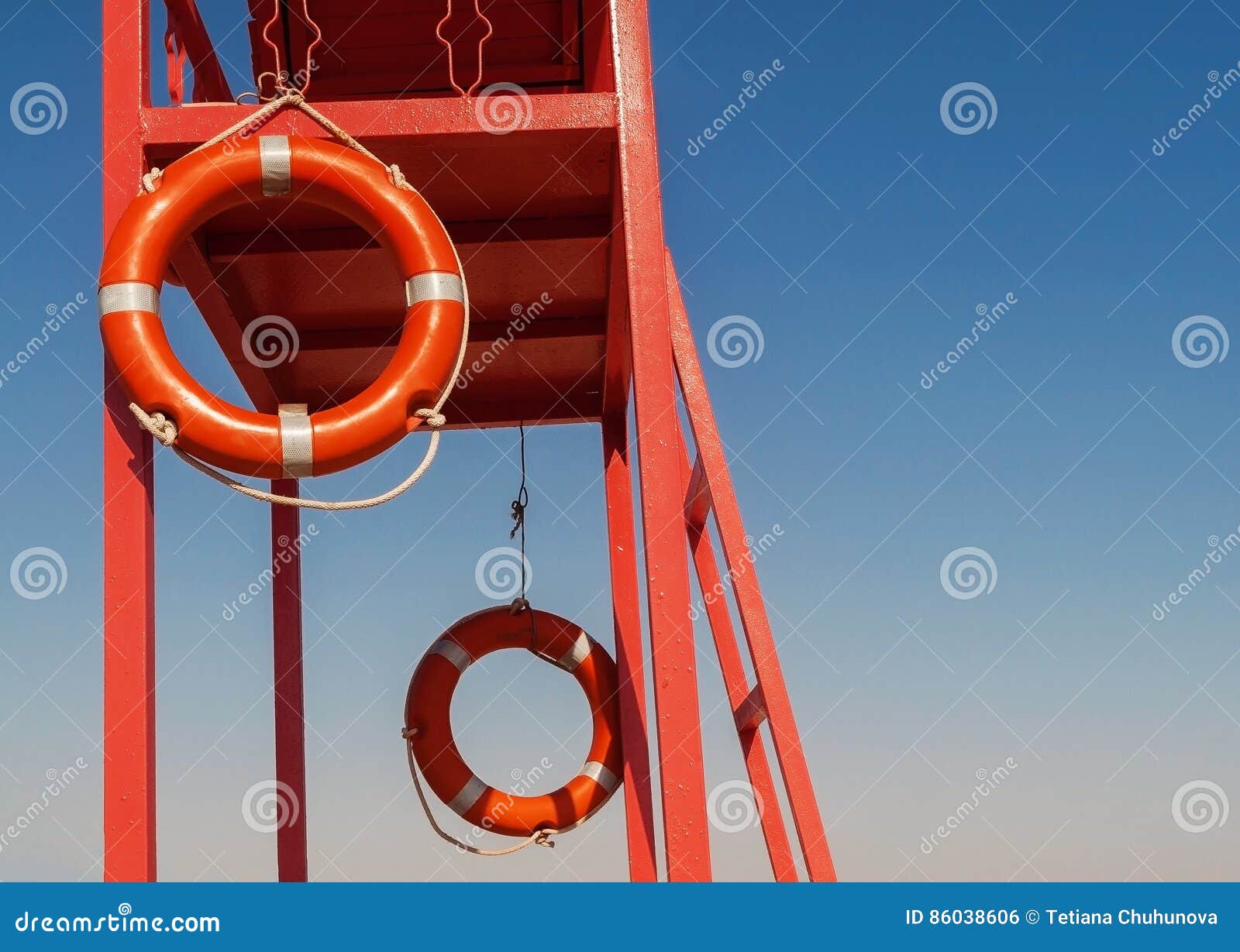 Red Rescue Tower with a Lifeline Against the Blue Sky Stock Photo ...