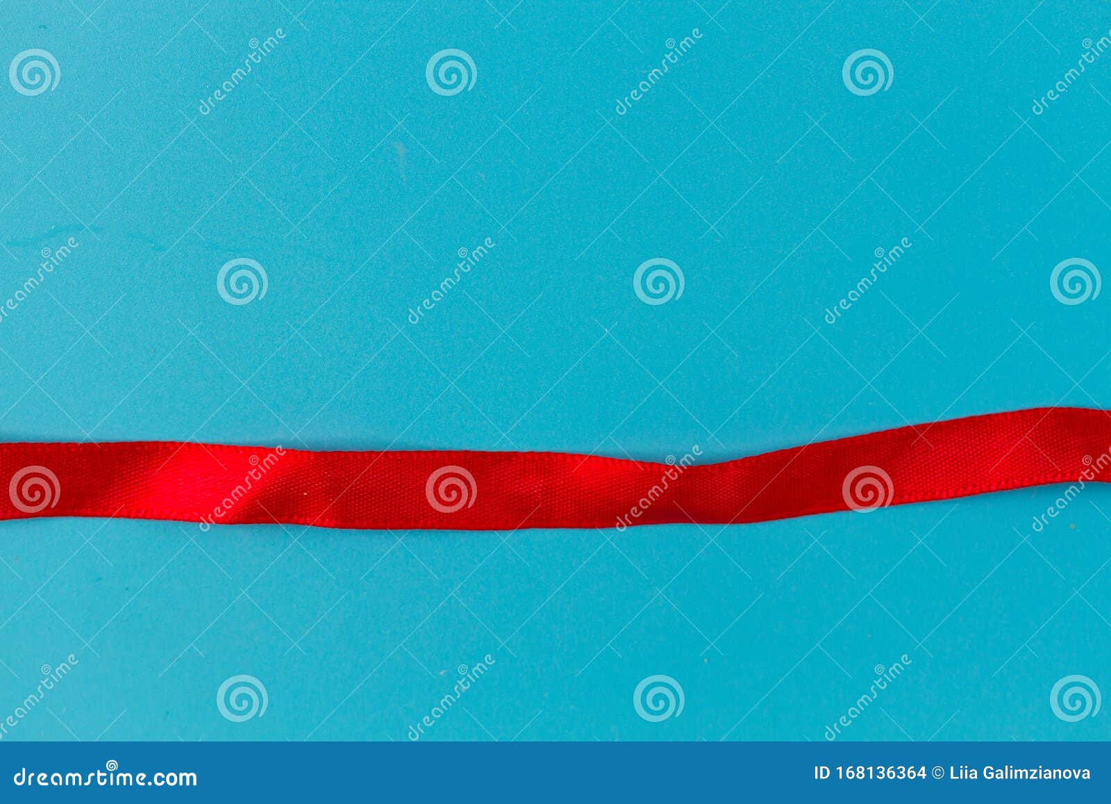 Red Ribbon on Blue Background Stock Photo - Image of beginning, start ...