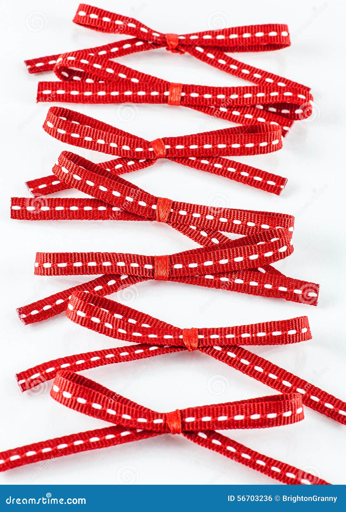 Red ribbons tied in bows stock photo. Image of twisted - 56703236