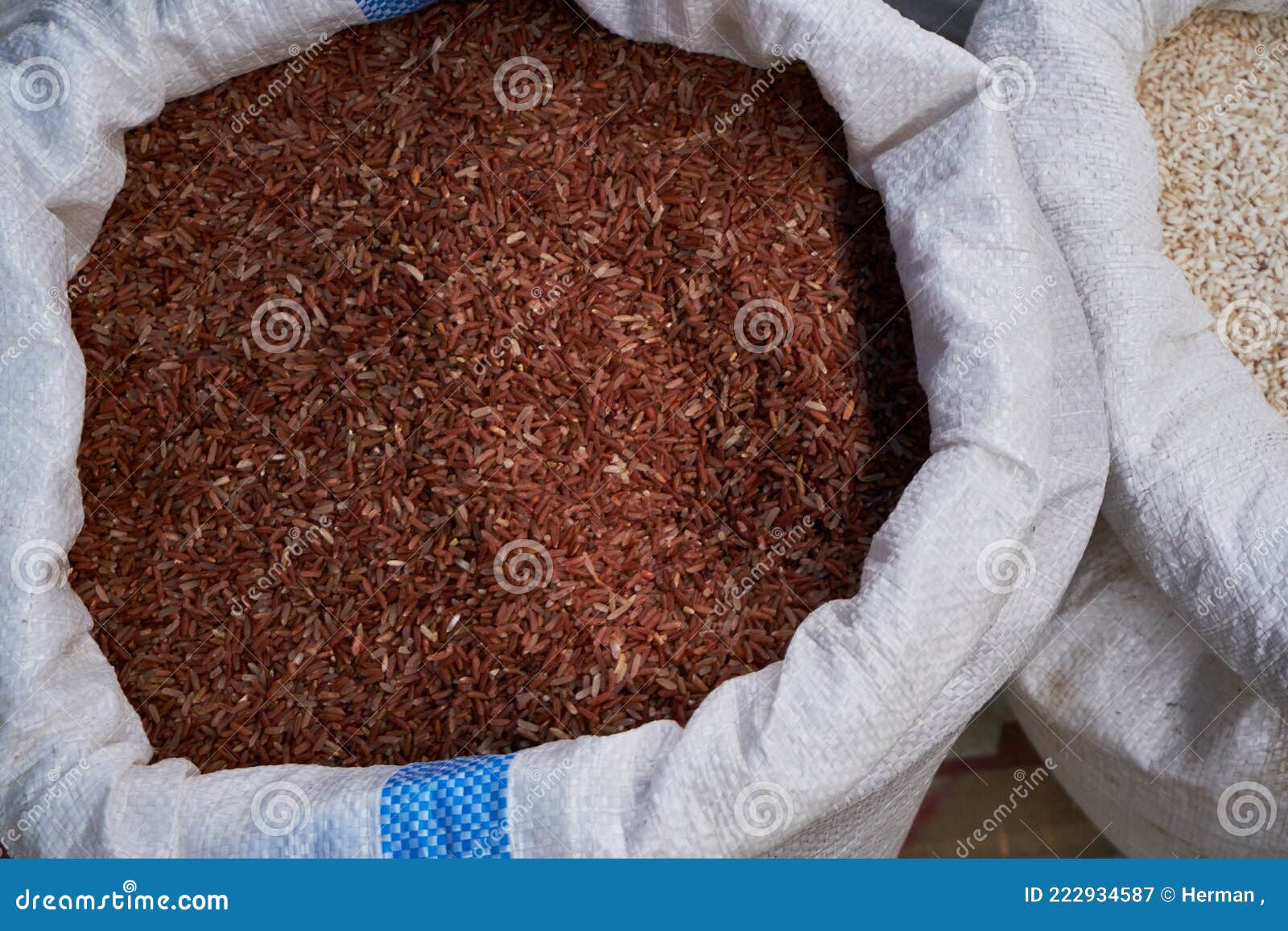 Red rice in the sack stock image. Image of market, food - 222934587