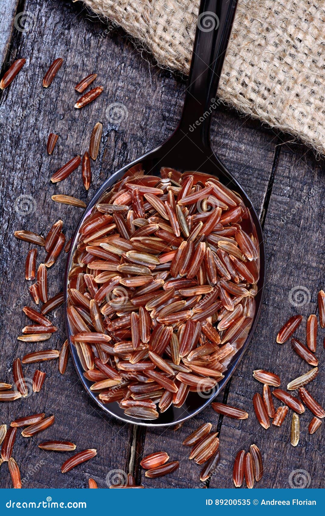 Red rice in a silver spoon stock image. Image of closeup - 89200535