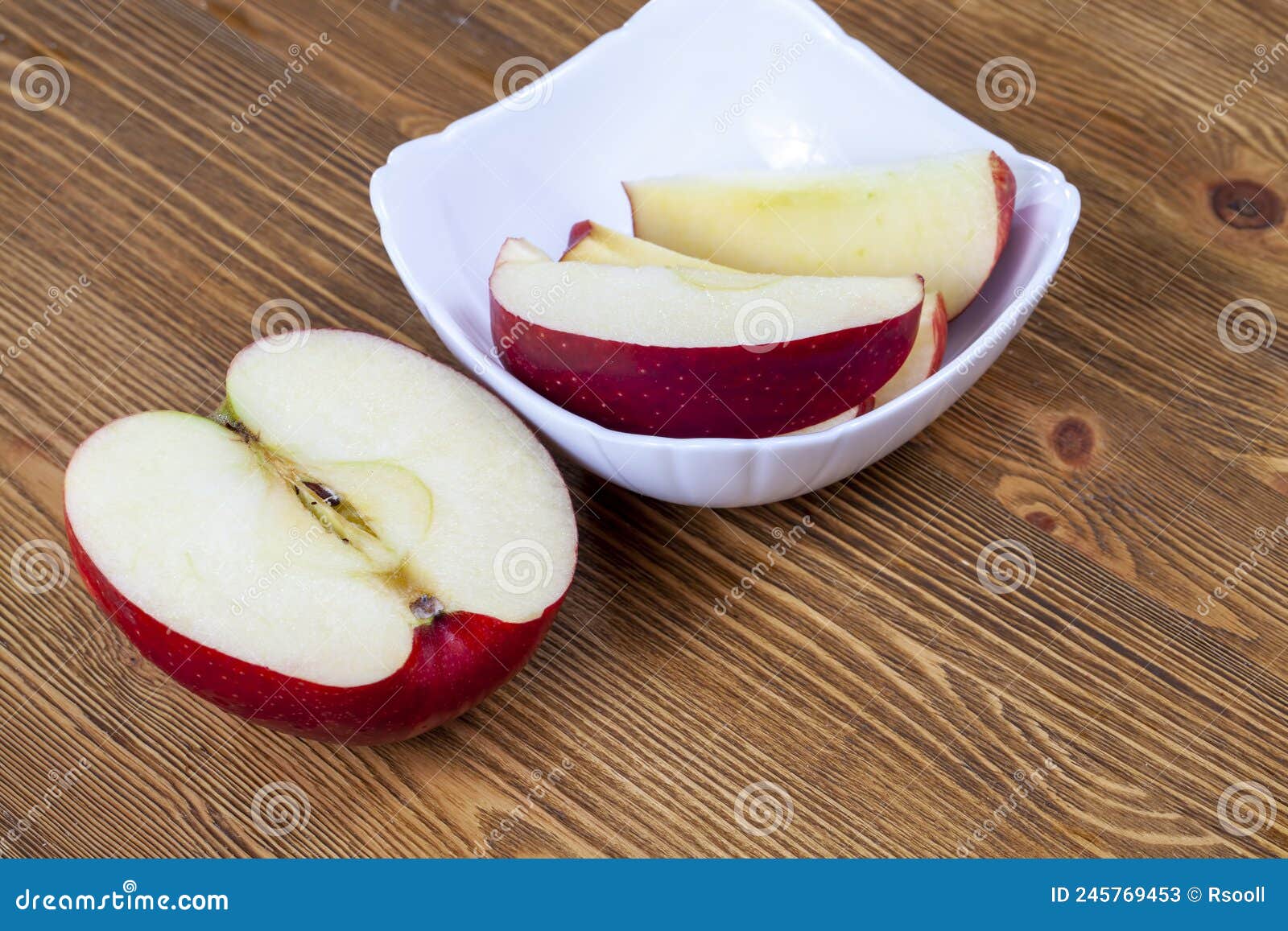 A Red Ripe Apple Cut into Pieces on the Table Stock Image - Image of ...