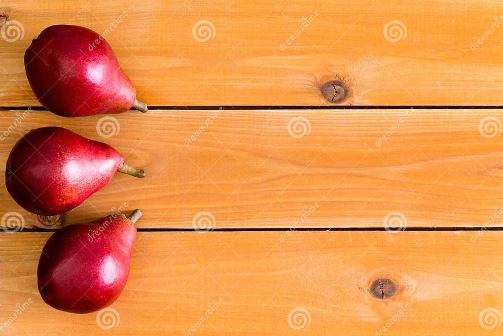 Red Ripe Pears on One Side of Table Surface Stock Photo - Image of ...