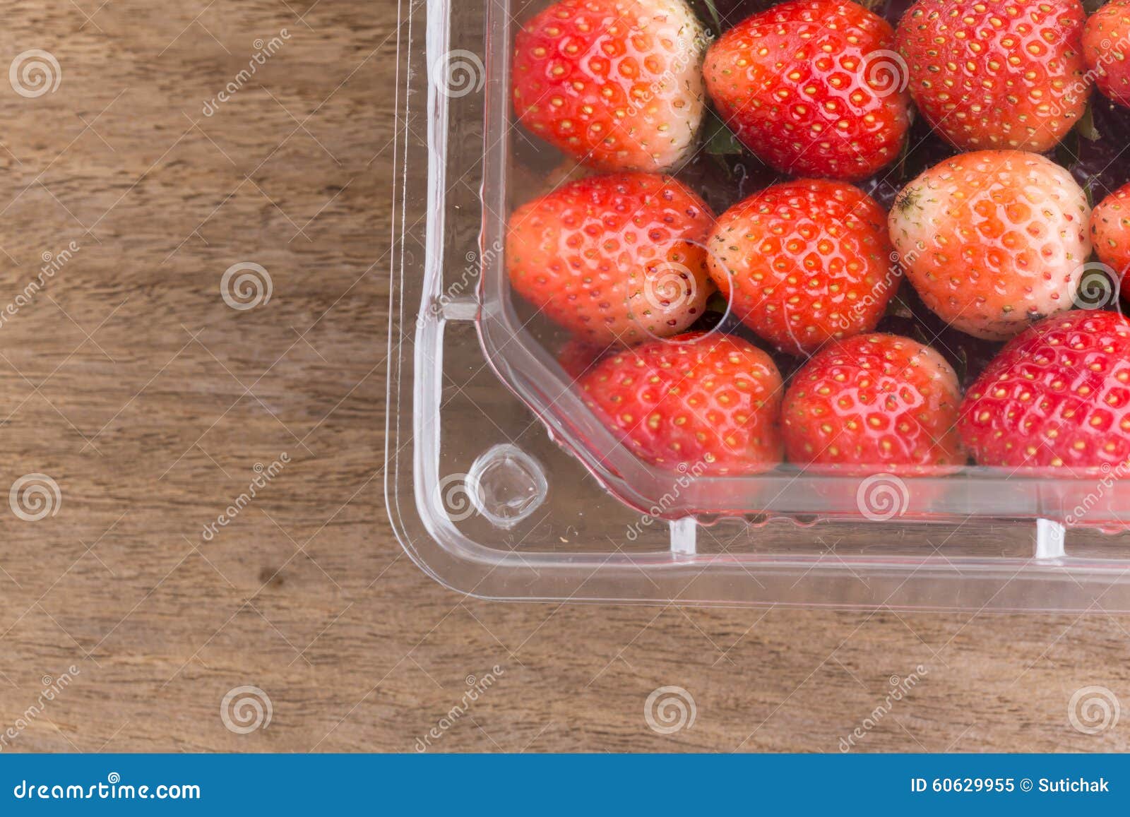 Red Ripe Strawberry in Plastic Box of Packaging on Wood Stock Image ...